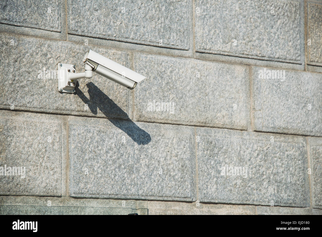 Security camera attached to the wall Stock Photo - Alamy