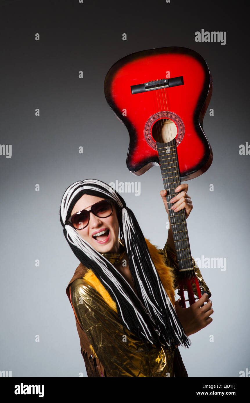 Guitar player with red instrument Stock Photo - Alamy