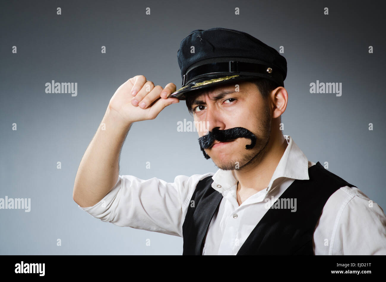 Funny taxi driver wearing peaked cap Stock Photo - Alamy
