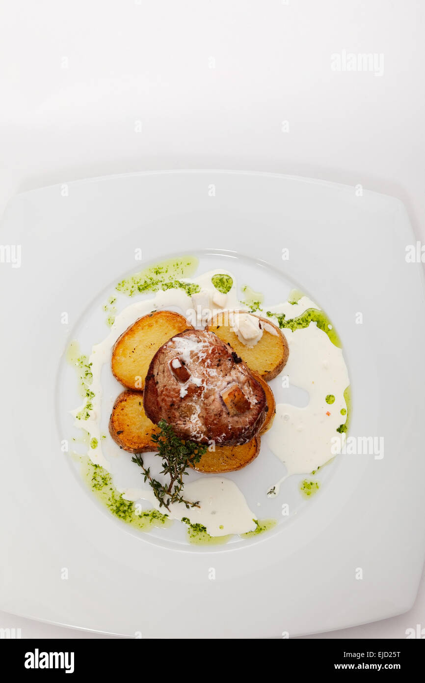 cooked dish of meat on a plate. close-up Stock Photo - Alamy