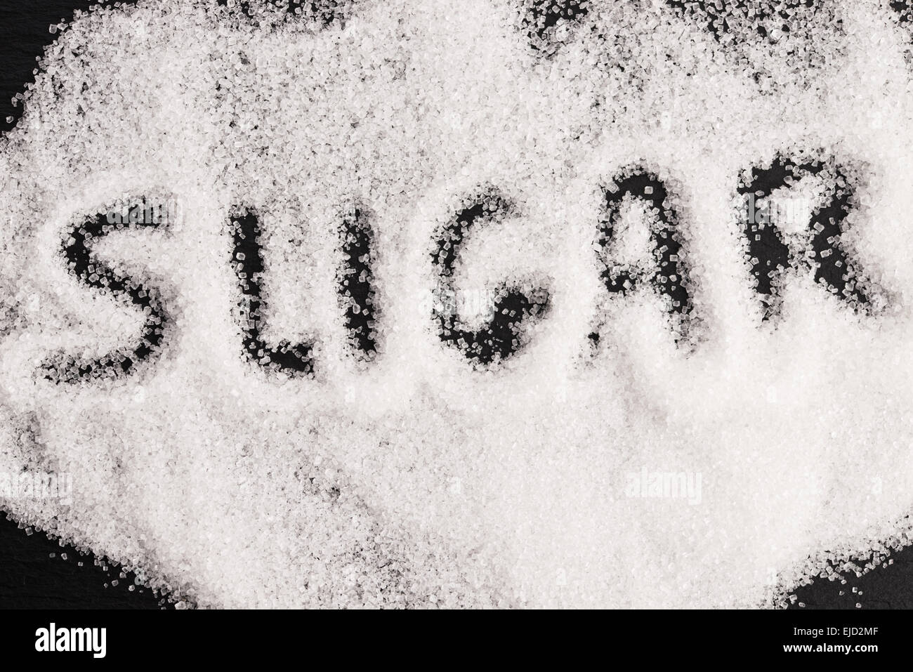 The word sugar written into a pile of white granulated sugar Stock ...