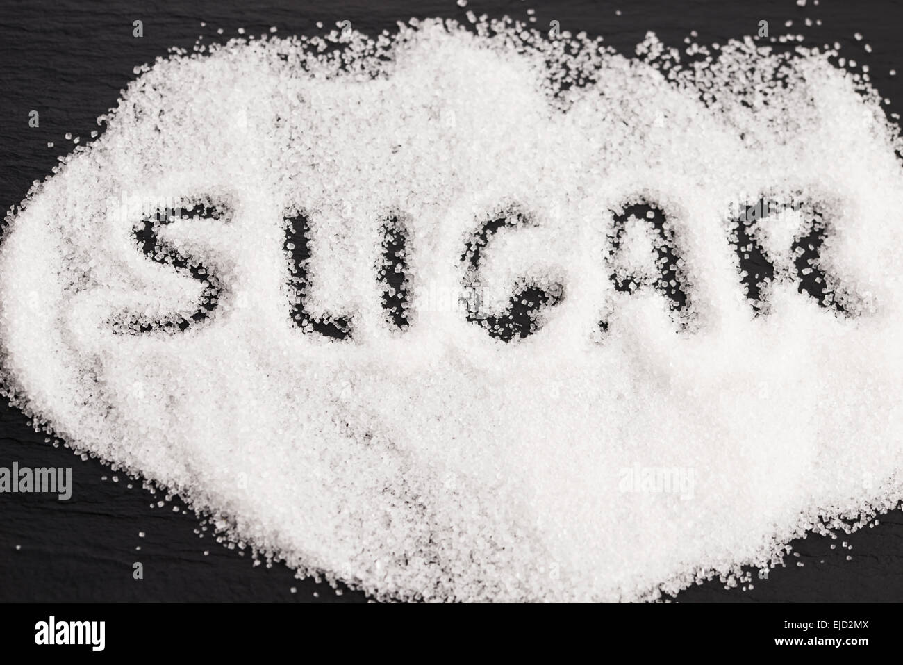 The word sugar written into a pile of white granulated sugar Stock ...