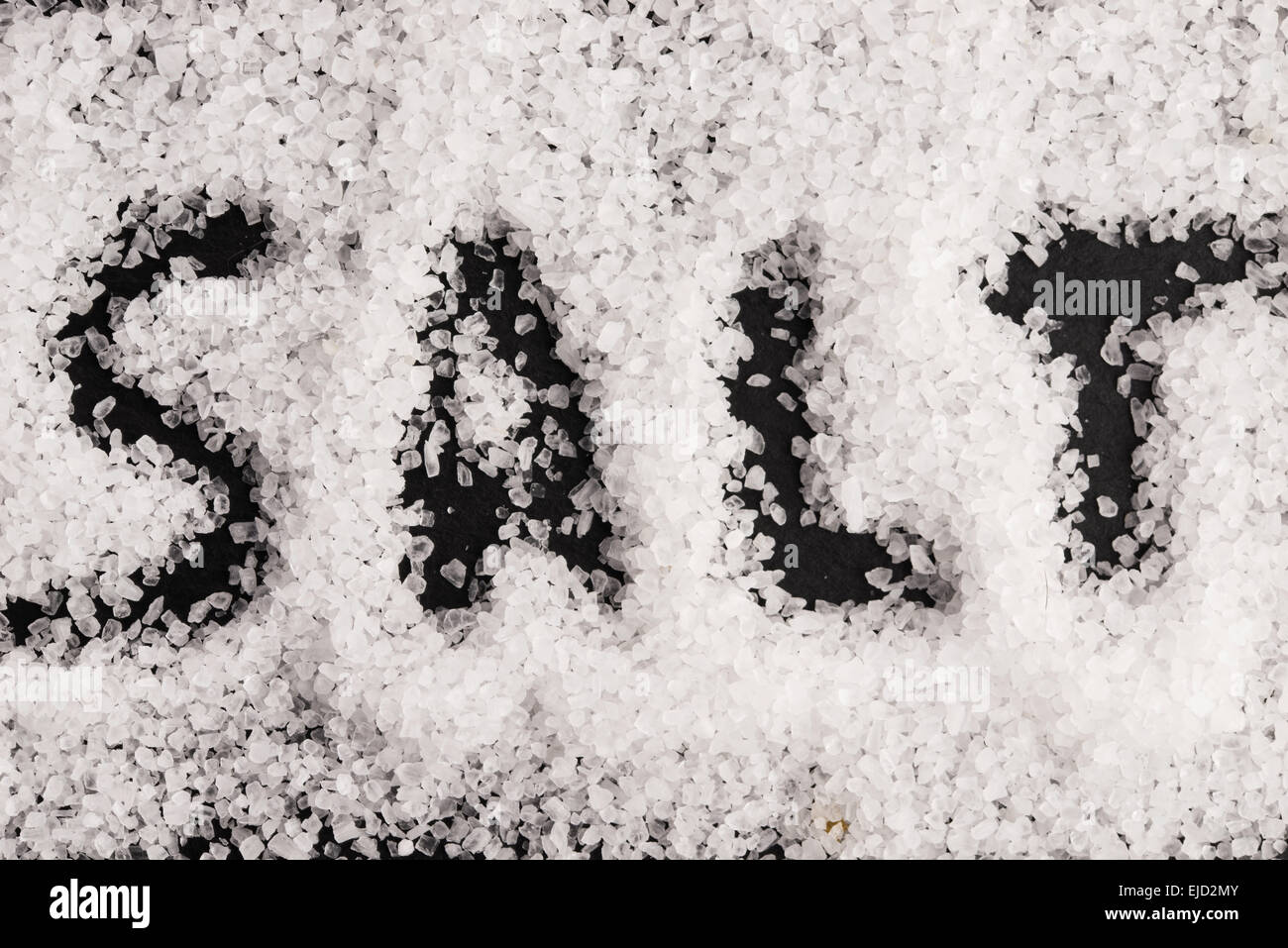 The word salt written into a pile of white granulated salt Stock Photo ...