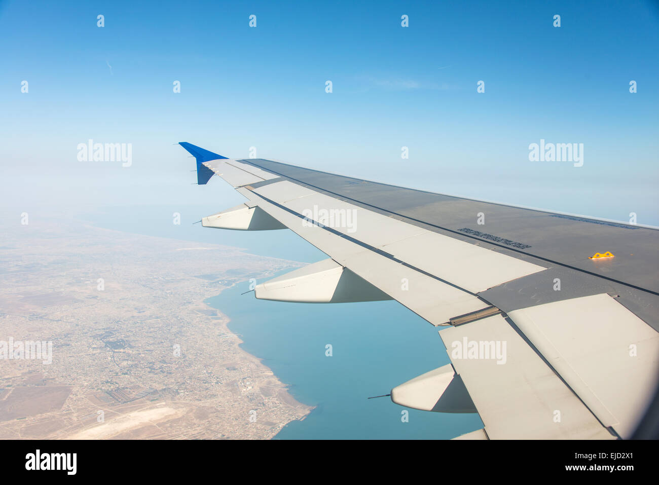 Airplane wing out of window Stock Photo - Alamy