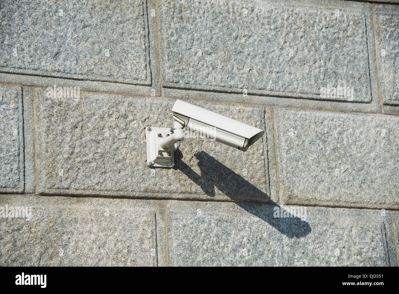 Security camera attached to the wall Stock Photo - Alamy