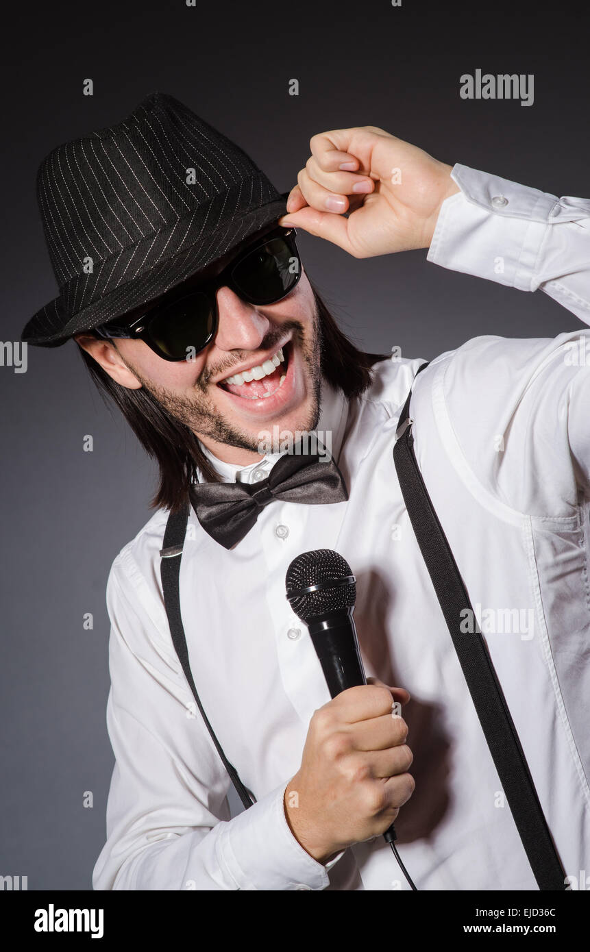 Funny singer with microphone at the concert Stock Photo - Alamy