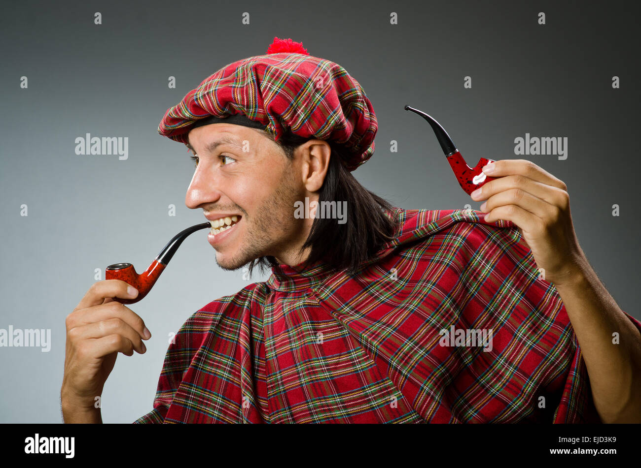 Funny scotsman with smoking pipe Stock Photo - Alamy
