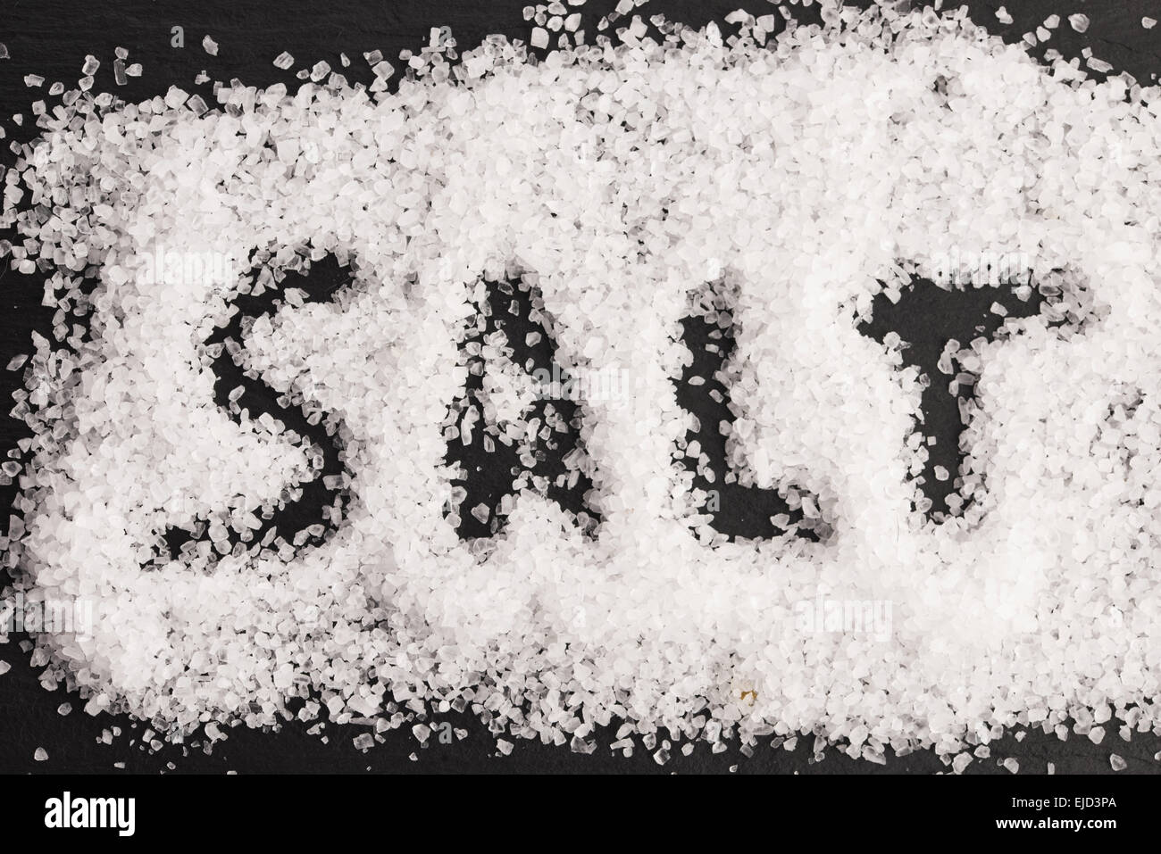 The word salt written into a pile of white granulated salt Stock Photo ...