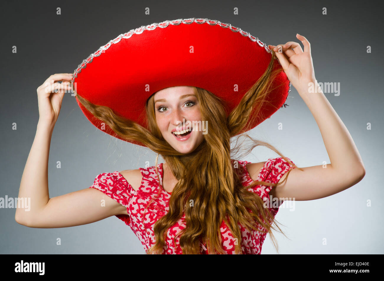 Mexican woman wearing red sombrero Stock Photo - Alamy