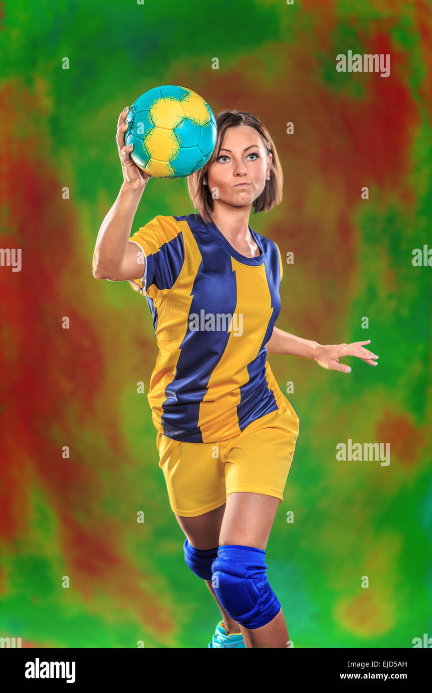 female handball player with a ball on the field Stock Photo - Alamy