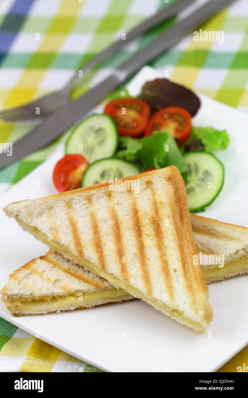 Toast with cheese and side green salad Stock Photo - Alamy