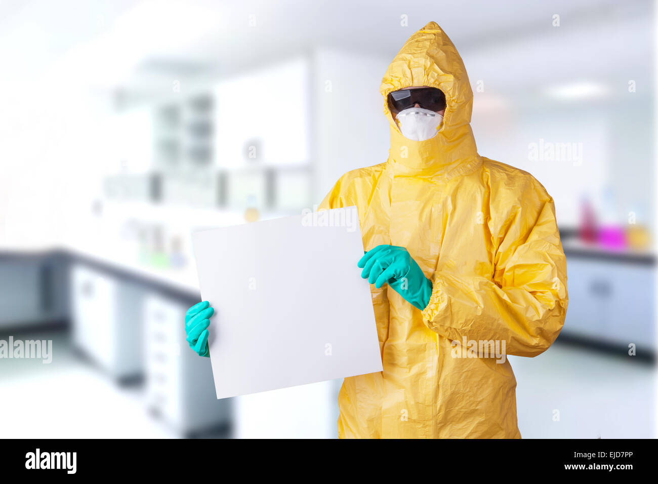 Scientist with protective yellow hazmat suit, ebola concept Stock Photo ...
