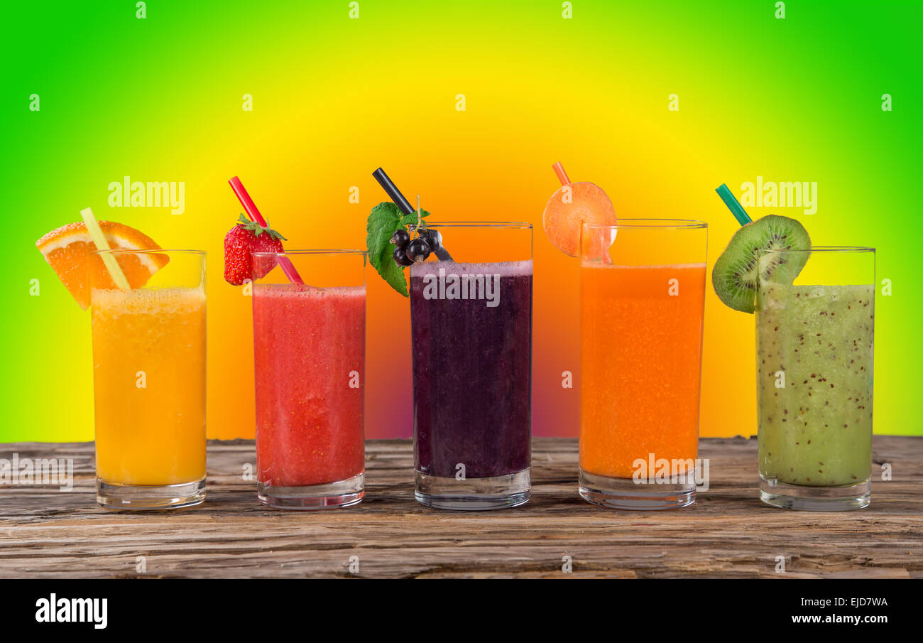 Fresh juice mix fruit, healthy drinks on wooden table Stock Photo - Alamy