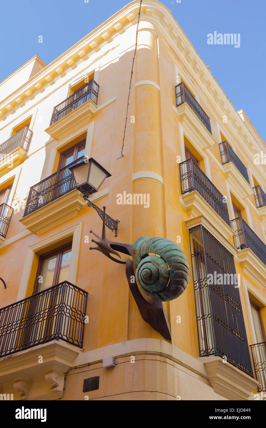 building with large bronze snail crawling on the Stock Photo - Alamy