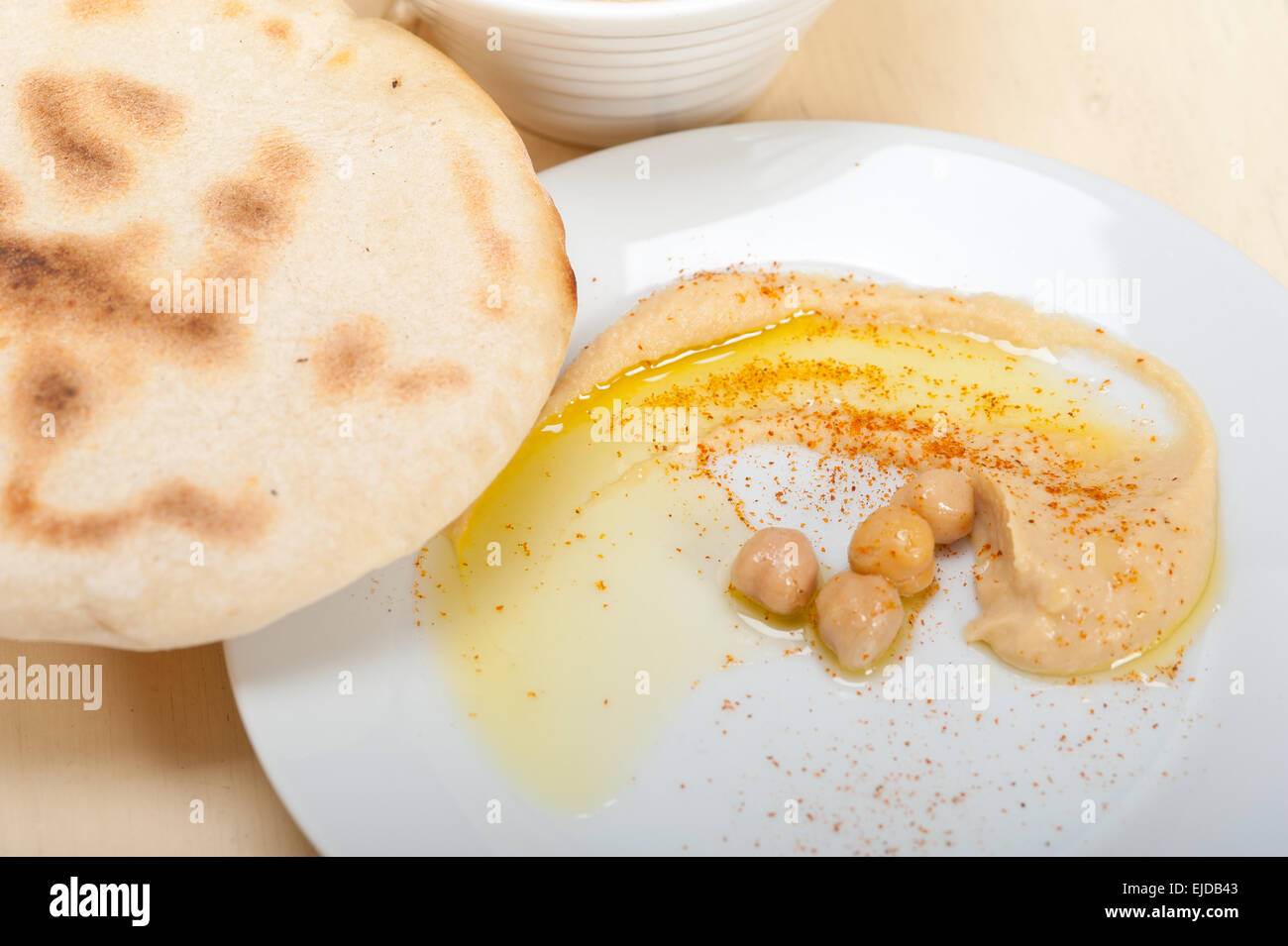 traditional chickpeas Hummus with pita bread and paprika on top Stock ...