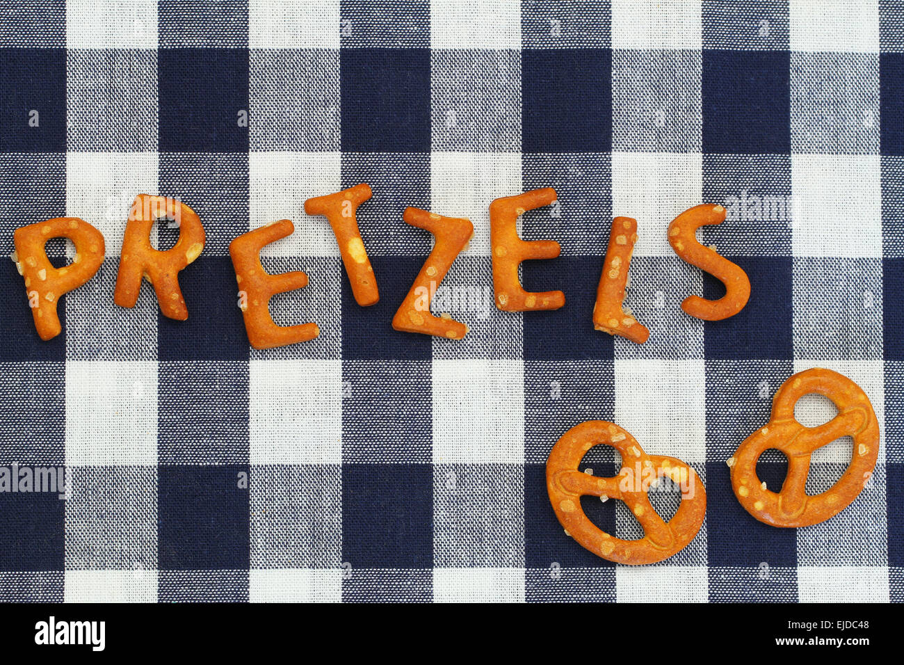 Word pretzels written with pretzel-like letters on checkered cloth ...