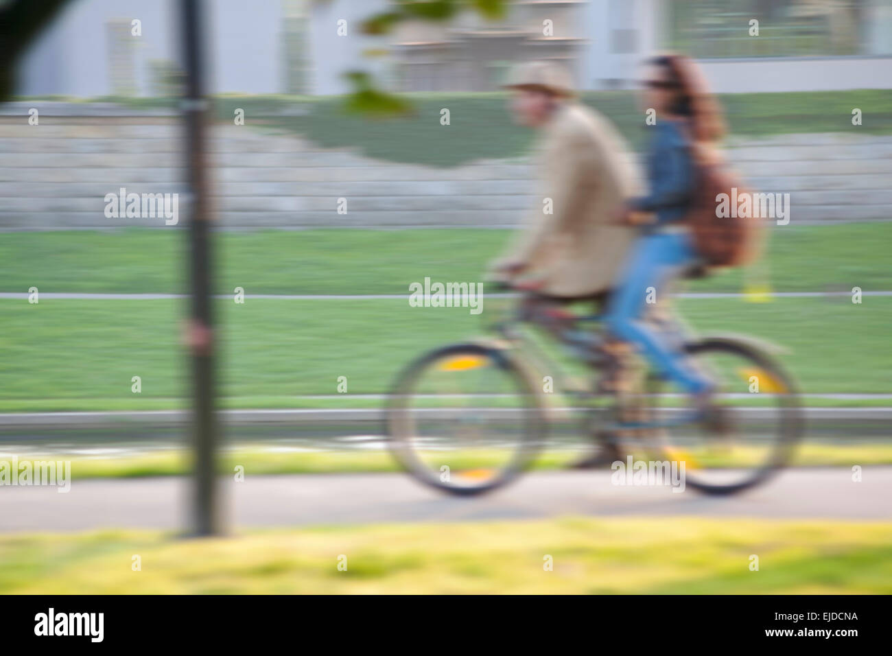 Woman riding along cycle path hi-res stock photography and images - Alamy