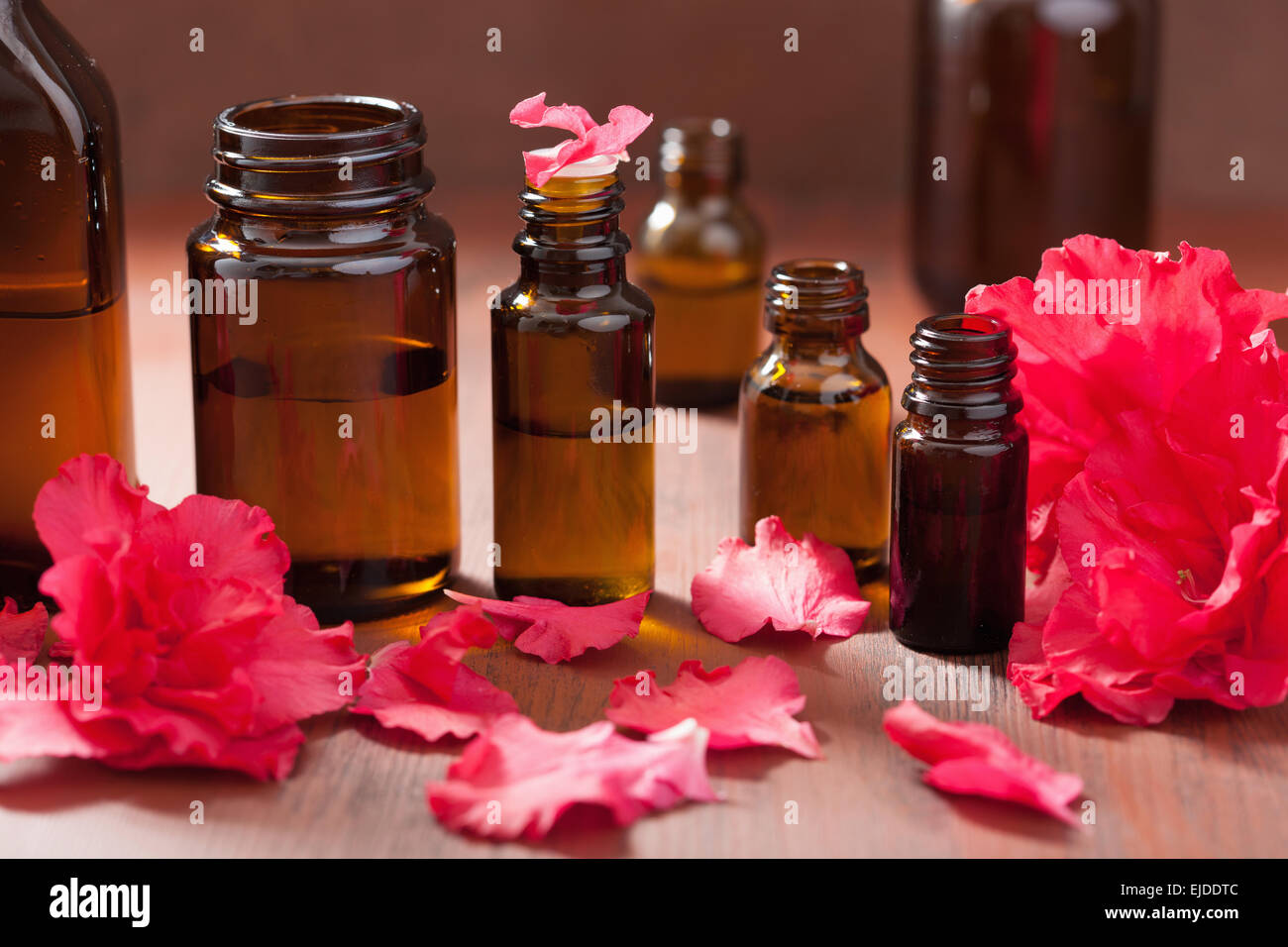 essential oil azalea flowers on dark rustic background Stock Photo - Alamy
