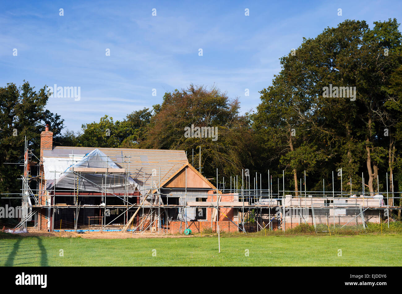 A family home under construction. A building site with scaffolding ...