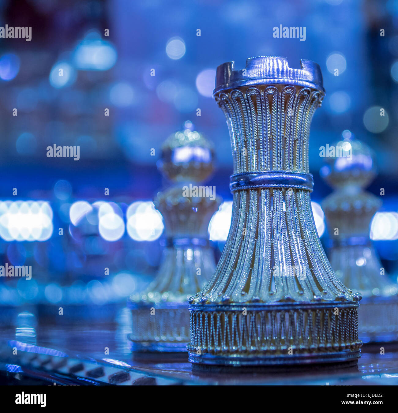 A silver Castle Rook piece as part of a chess set Stock Photo - Alamy