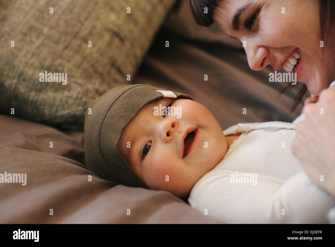 Baby on mother back hi-res stock photography and images - Alamy