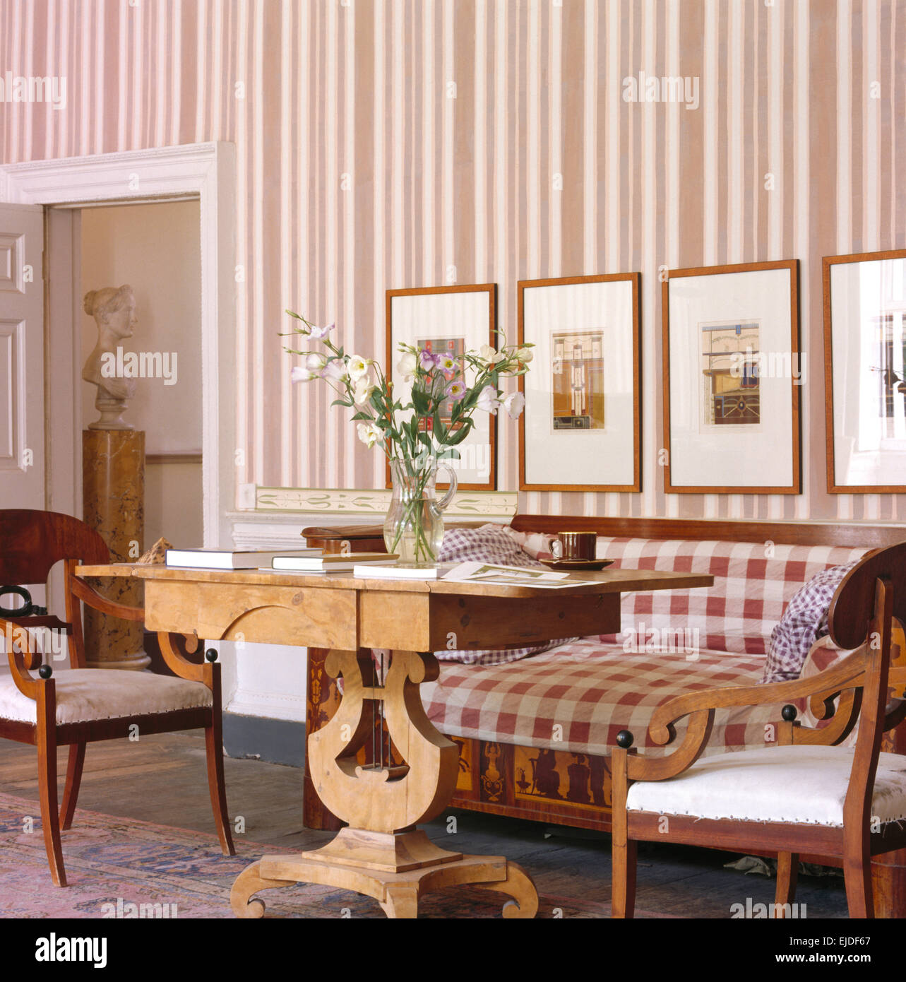 Brown striped wallpaper in nineties living room with Biedermeier table ...
