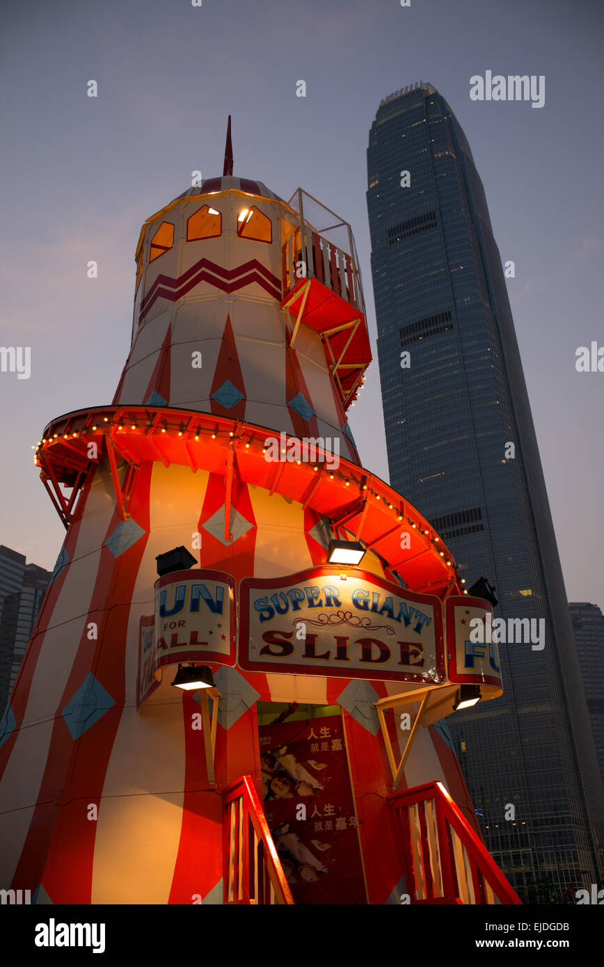 Helter Skelter slide ride at the AIA Carnival with IFC building in the ...