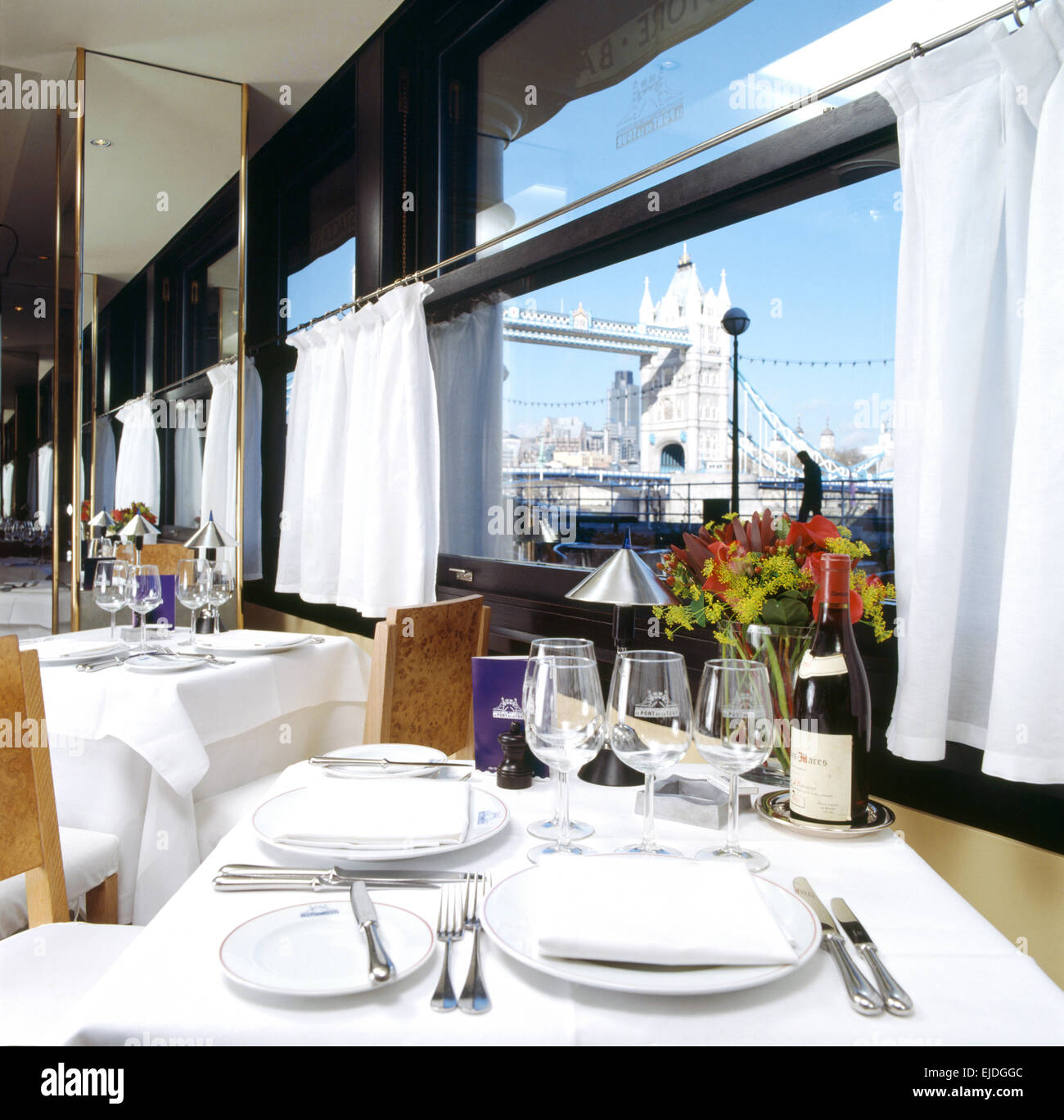 Tables set for lunch in the Pont de la Tour restaurant, London, with ...