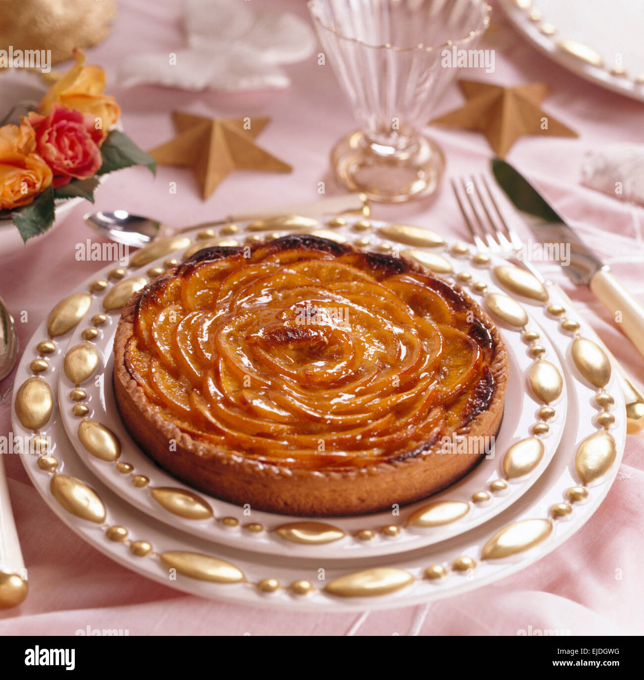 Close-up of an apple flan on a gold textured plate Stock Photo - Alamy