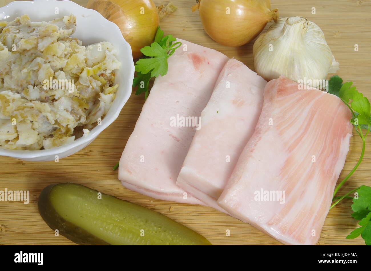 pork fat with parsley on board background Stock Photo - Alamy