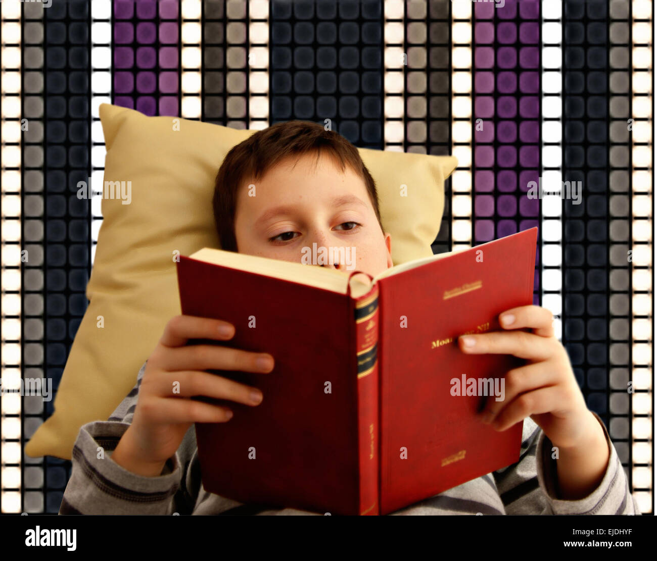 Boy reading a book Stock Photo - Alamy