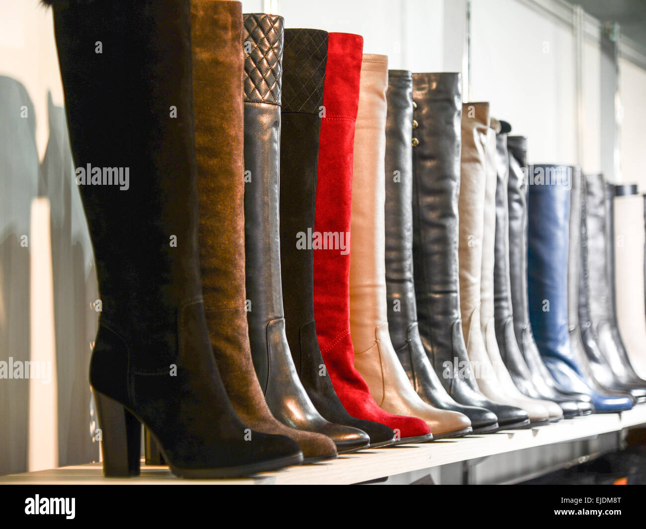 women's boots on the shelves in the store Stock Photo - Alamy