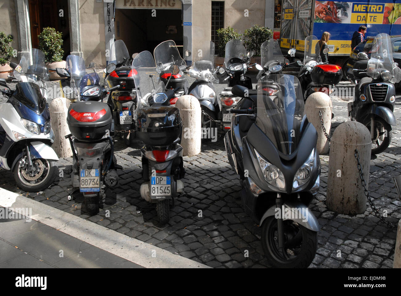 Scooters parked up in central Rome Stock Photo - Alamy