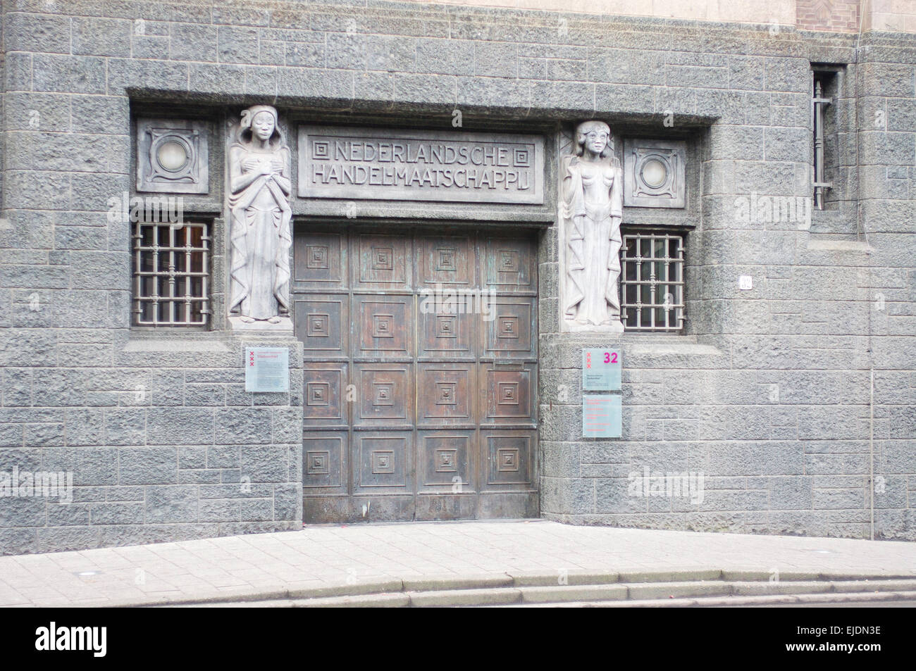 Housed inside a massive gray and pink stone building, the entry to the ...