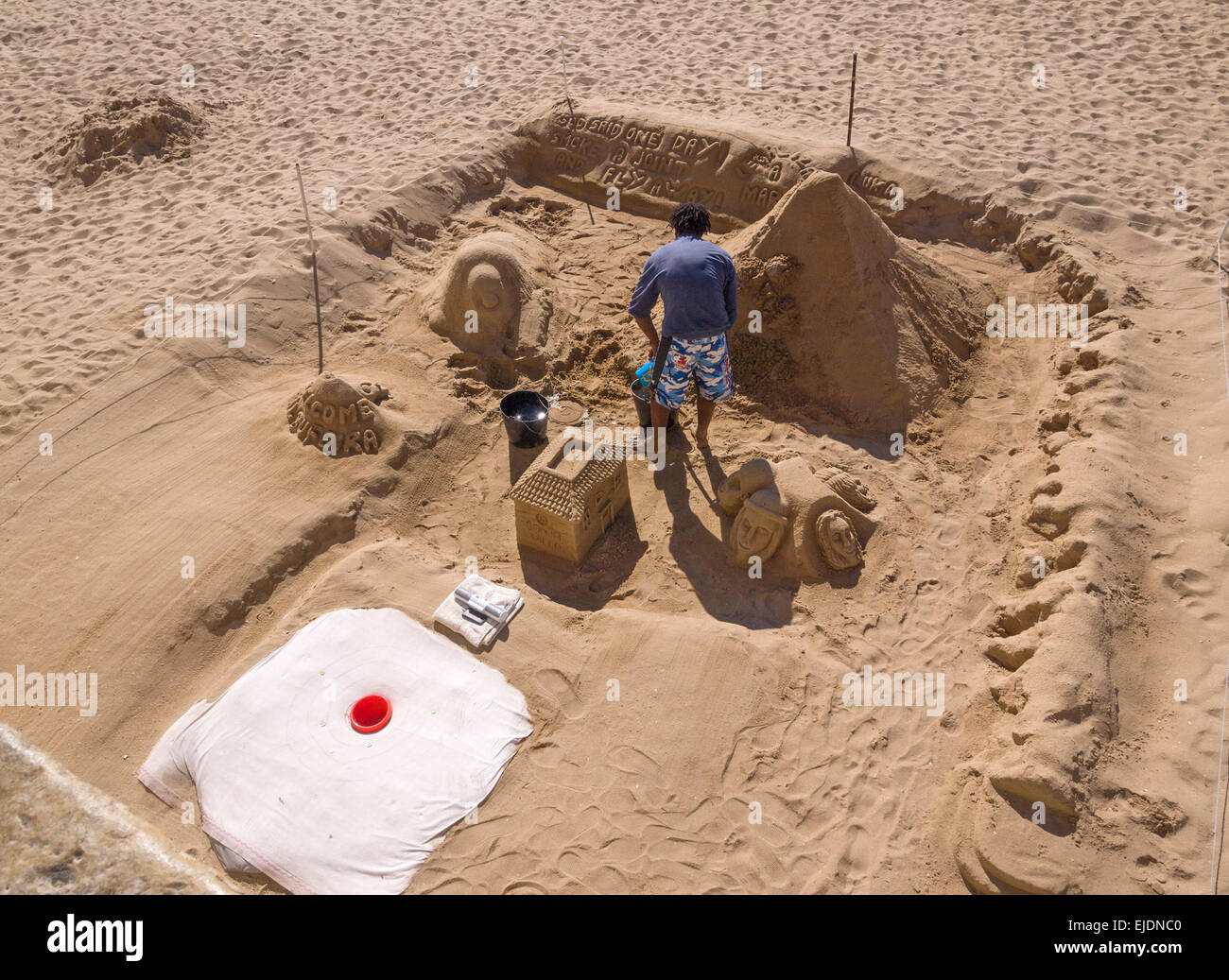 People making sand sculptures at the beach Stock Photo - Alamy