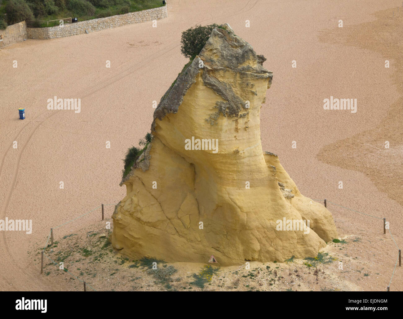 Big rock formation in the middle of the beach at Albufeira, Algarve ...