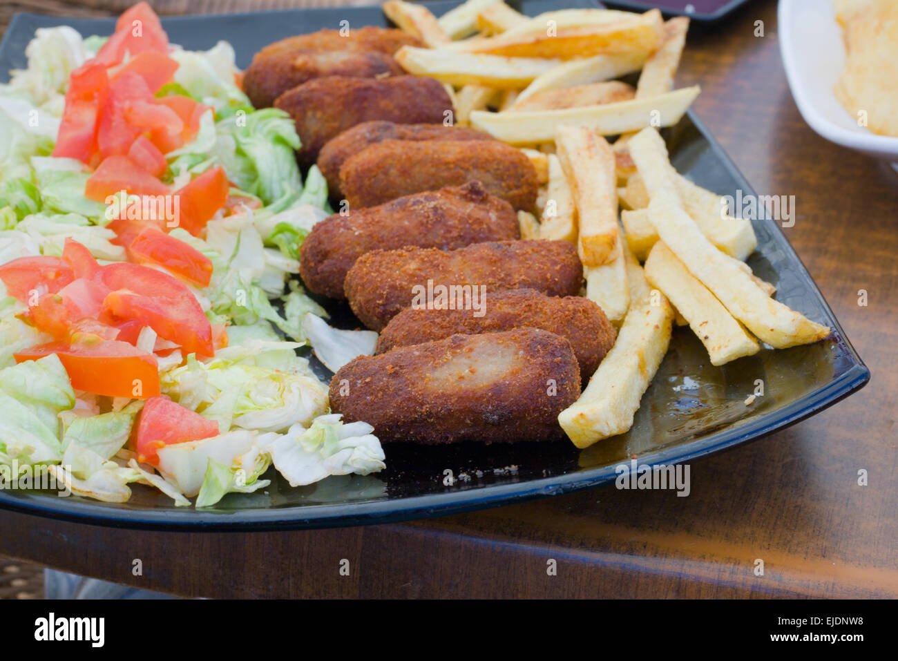 Cured Ham Spanish Croquettes with salad and french fried potatoes Stock ...