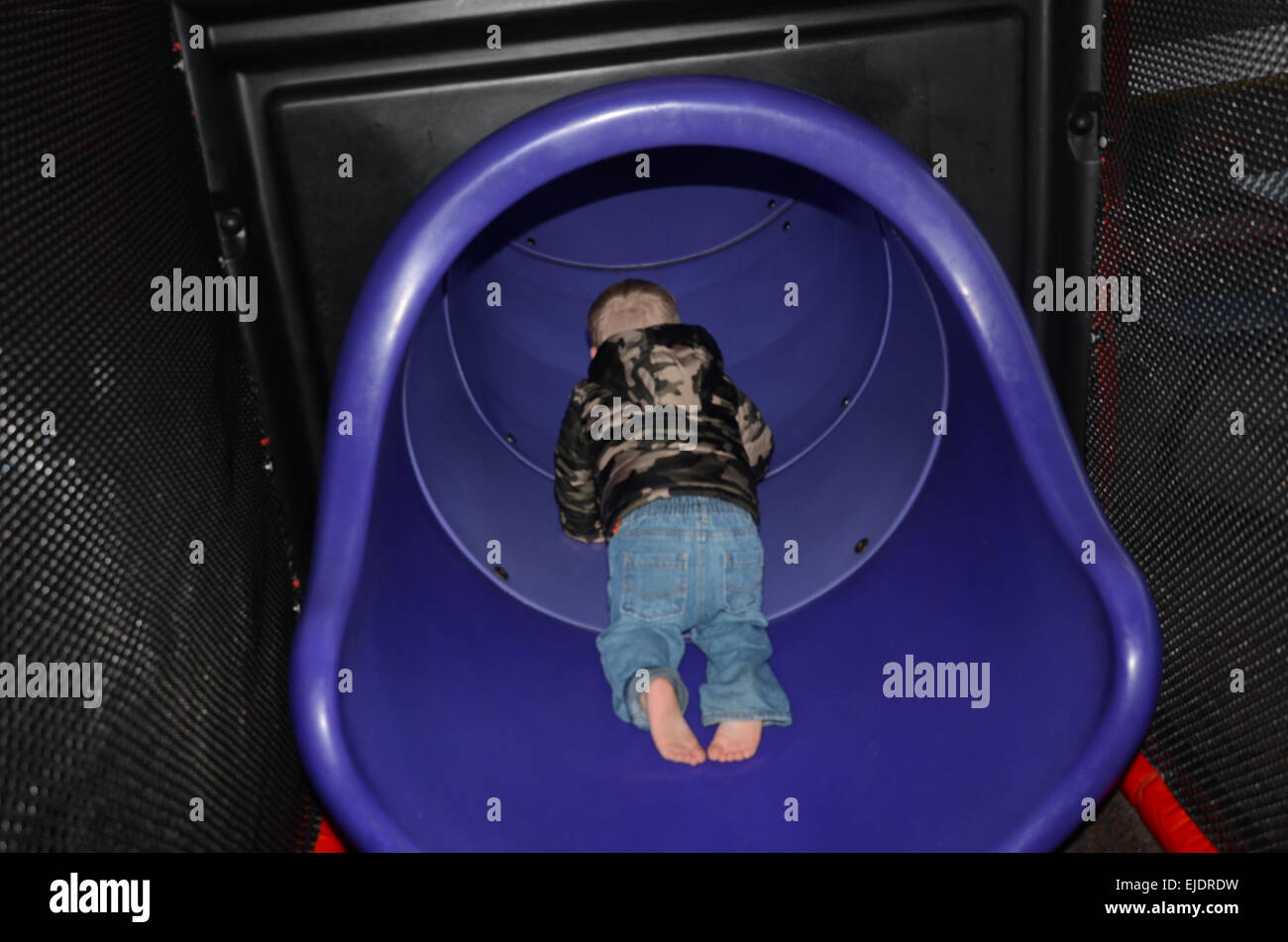 My son Jev crawling up the slide at the playground Stock Photo - Alamy