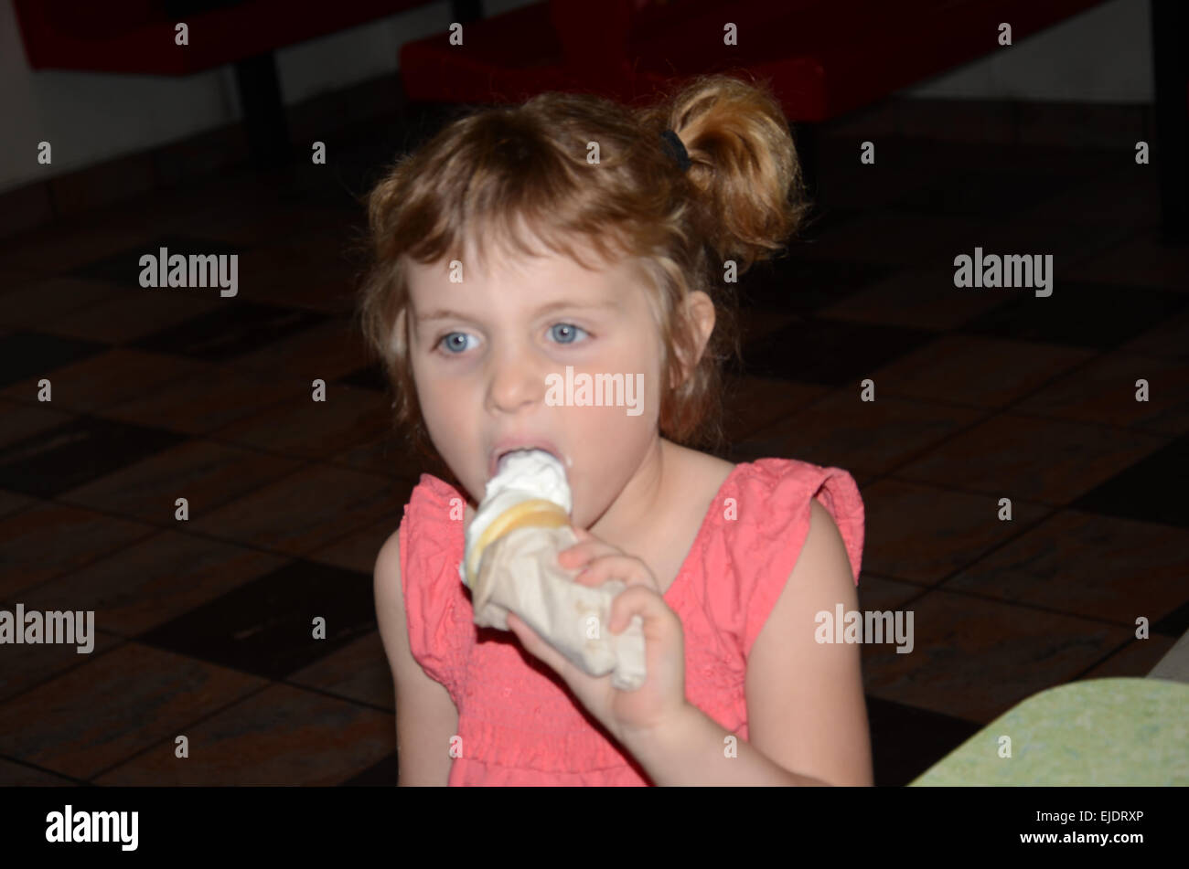 My daughter Angel eating an ice cream cone Stock Photo - Alamy
