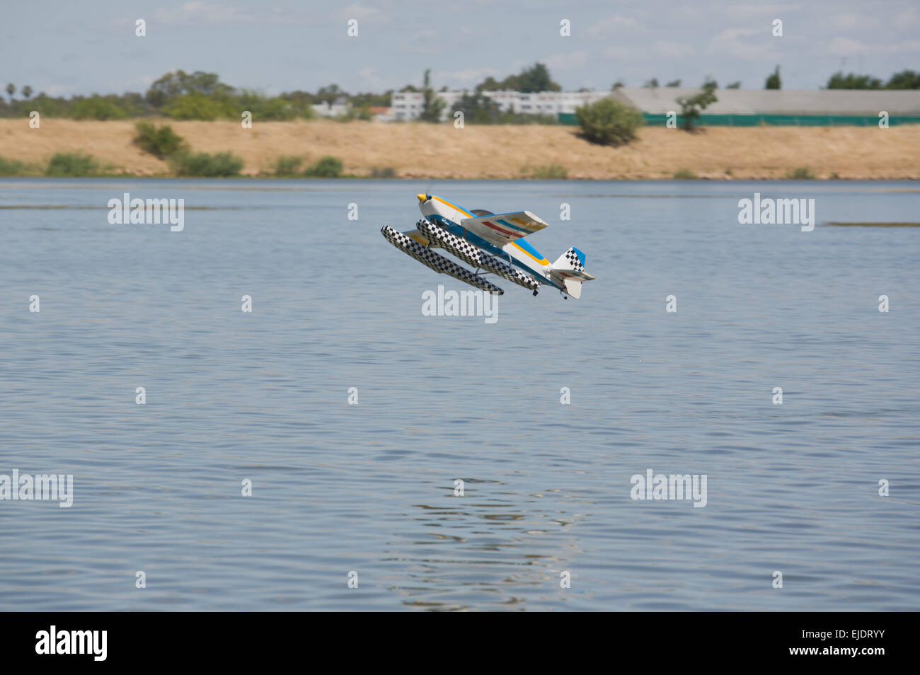 Radio controlled Hydroplane flying over Guadiana river surface, Badajoz ...