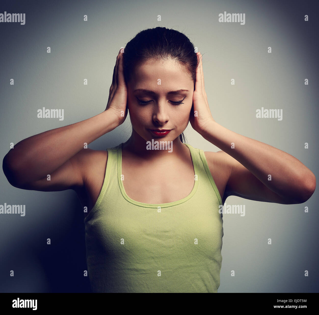 Confusion unhappy thinking woman with headache on dark background ...