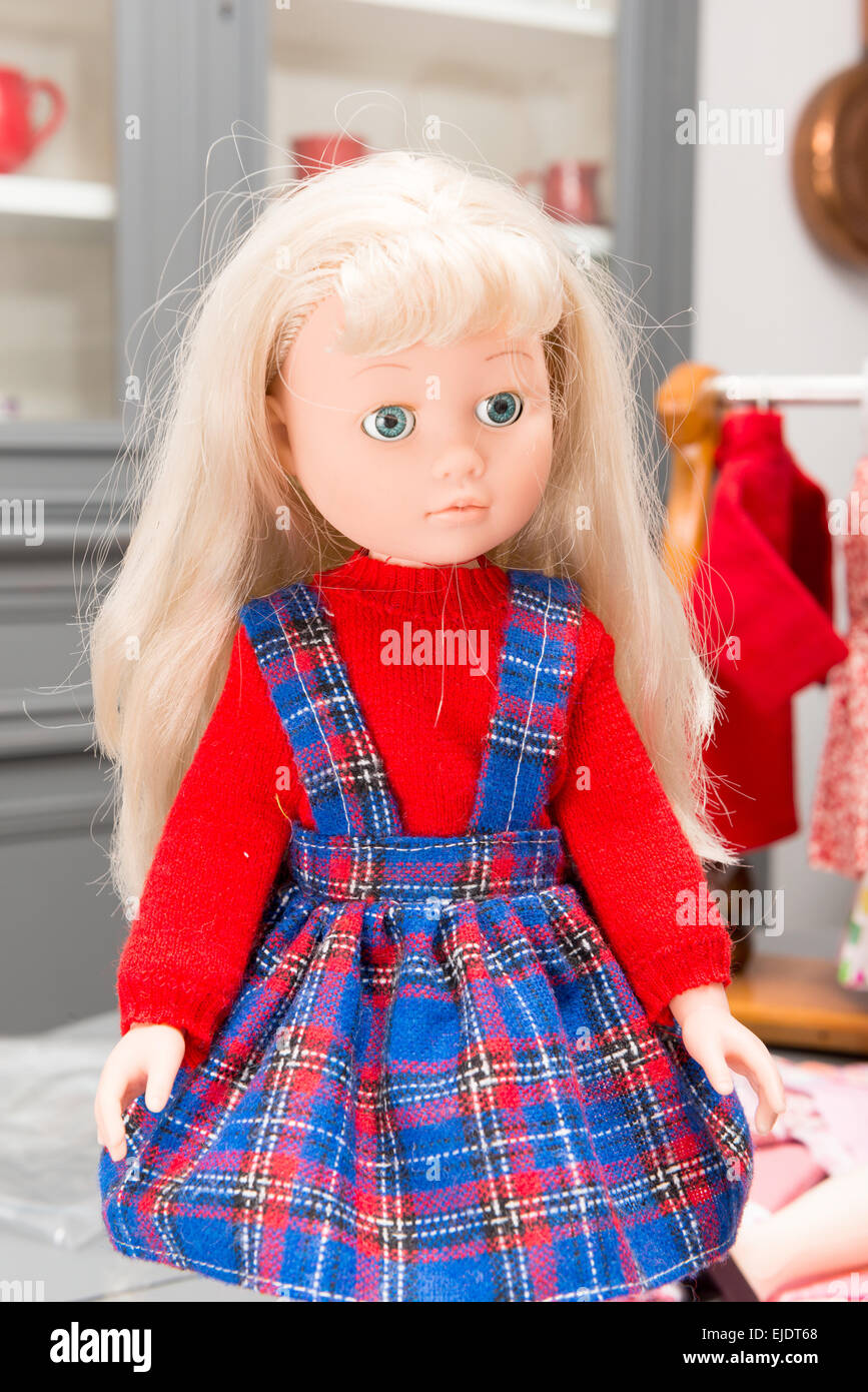 blonde doll with blue and red dress Stock Photo - Alamy