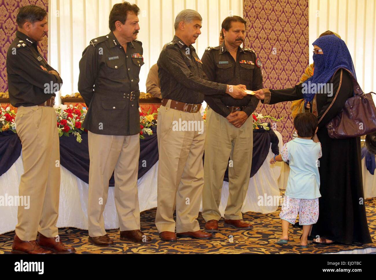 IGP Sindh Ghulam Hyder Jamali distributing compensation cheques among ...