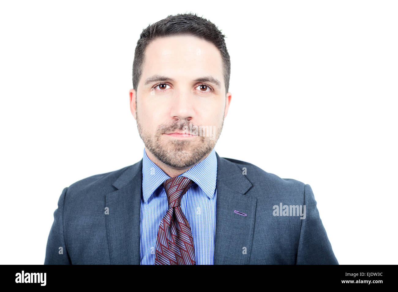 A beautiful business man standing against grey background Stock Photo ...