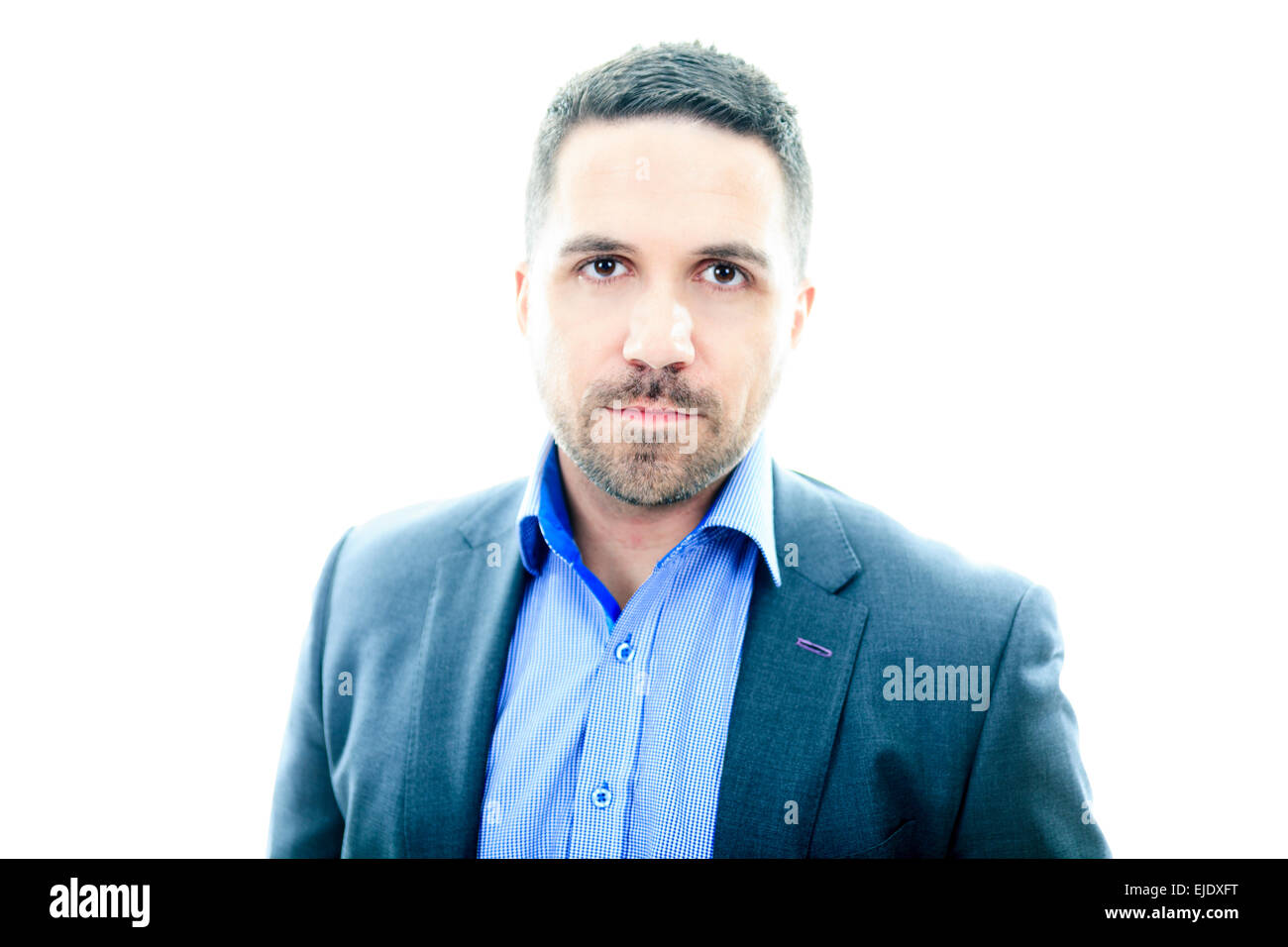 A beautiful business man standing against grey background Stock Photo ...