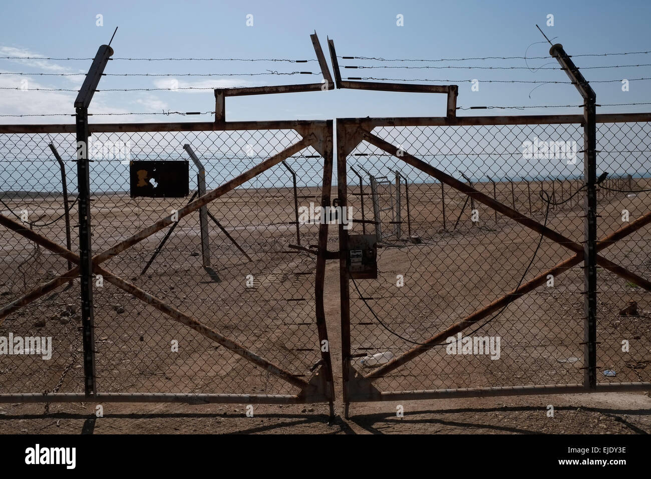 A closed gate in the border fence with Jordan in the Jordan valley ...
