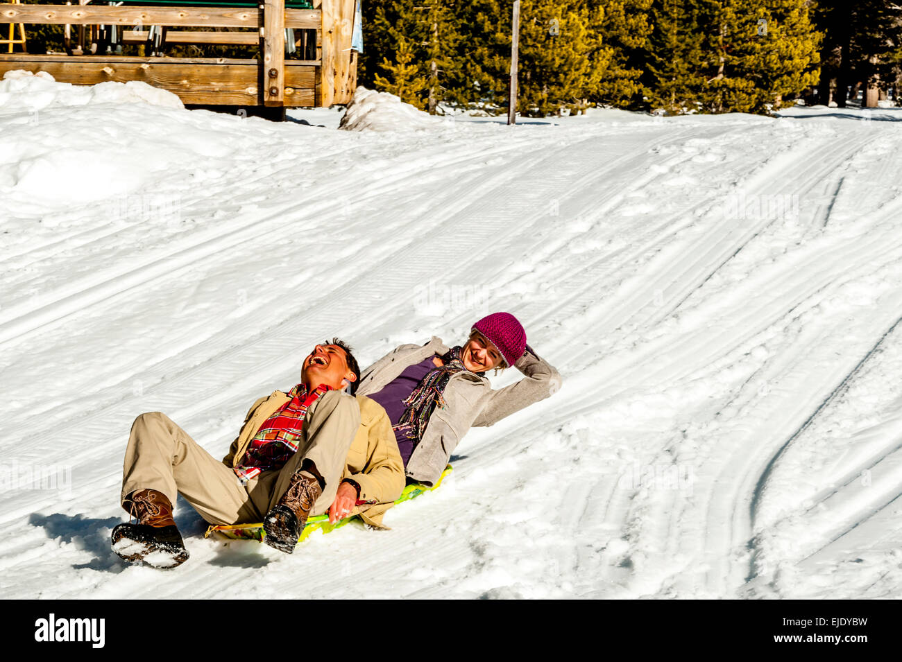 Sledding two people hi-res stock photography and images - Alamy