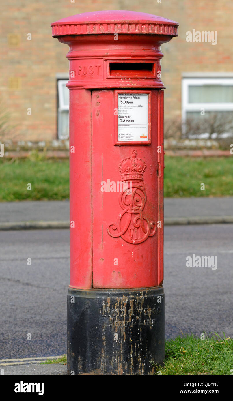 Red postbox. Royal Mail Pillar Box in England, UK. Postbox red. Red ... Red postbox. Royal Mail Pillar Box in England, UK. Postbox red. Red ...