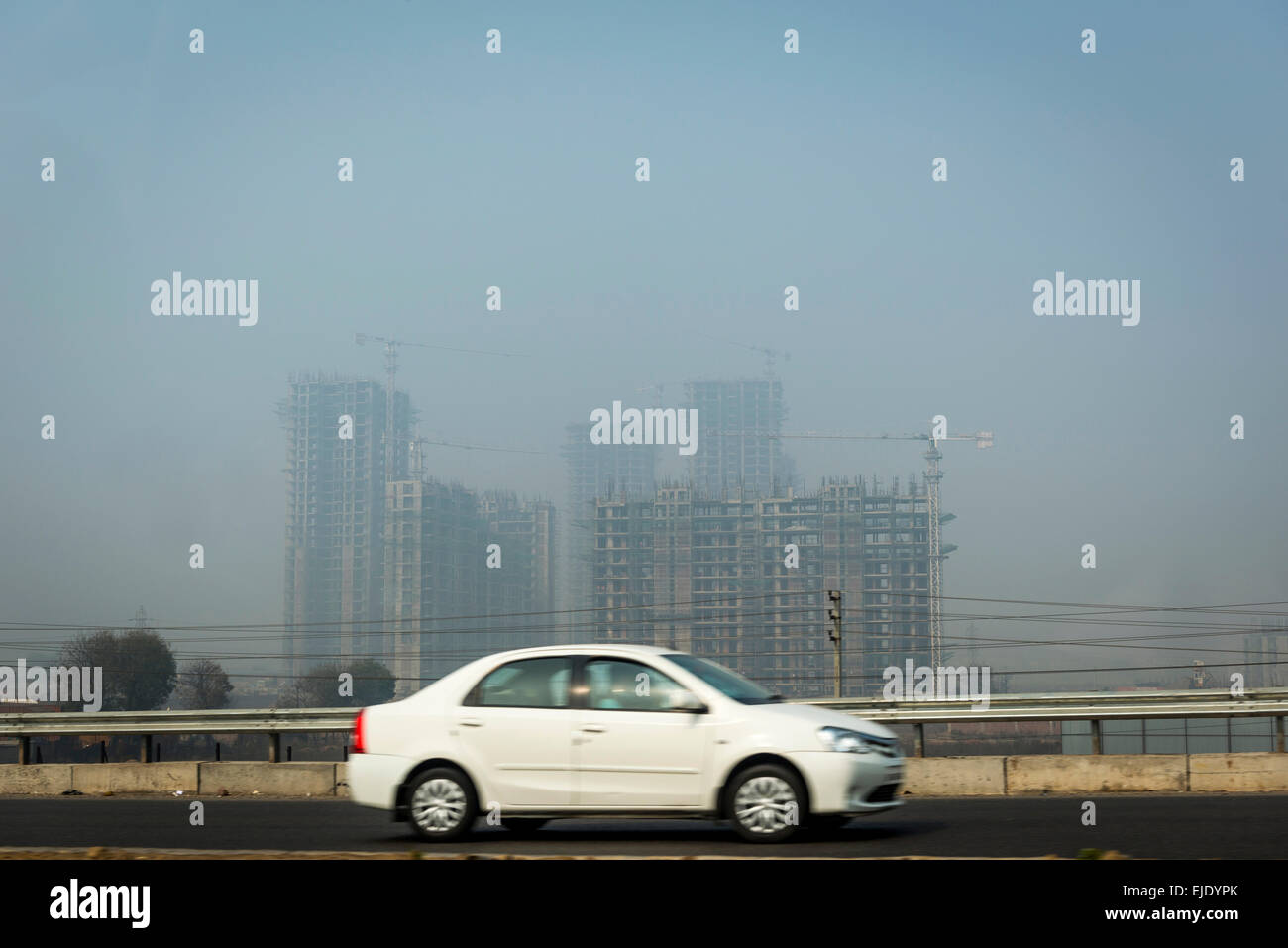 Huge roadside building development along the motorway between New Delhi ...