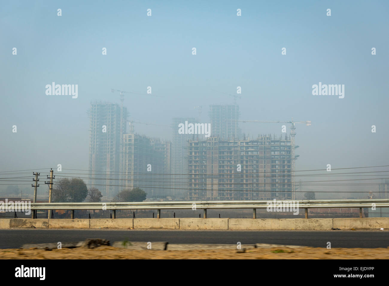 Huge roadside building development along the motorway between New Delhi ...
